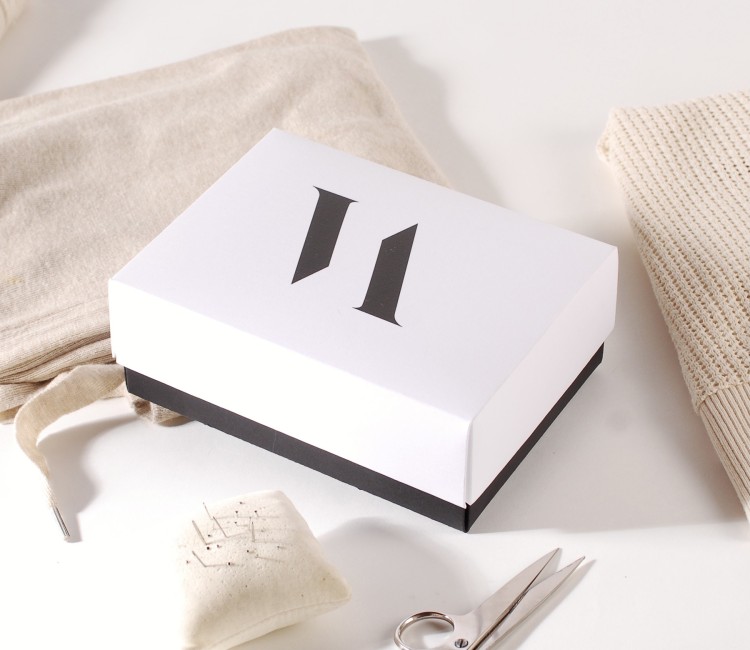 Cardboard shirt box with stopper